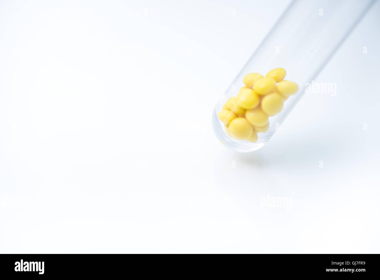pills or drugs in glass test tube Stock Photo - Alamy