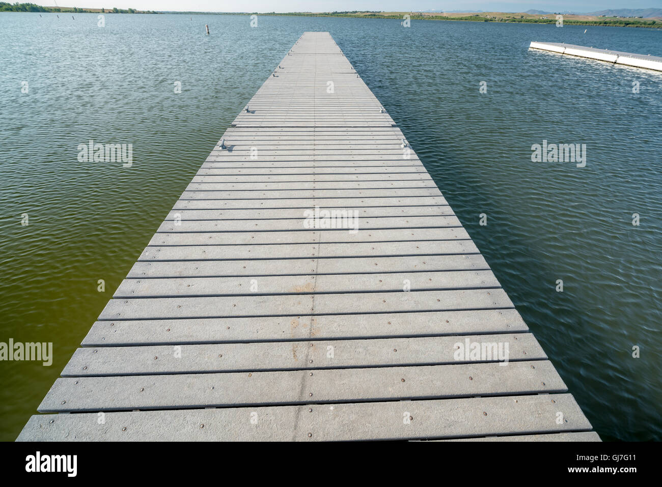 Lake boat Dock with water and horizon Stock Photo - Alamy