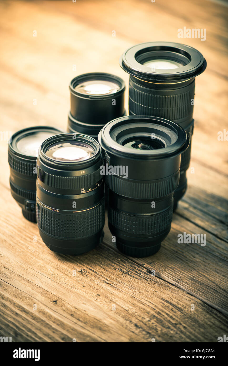 filtered image of photography lenses on desk Stock Photo - Alamy