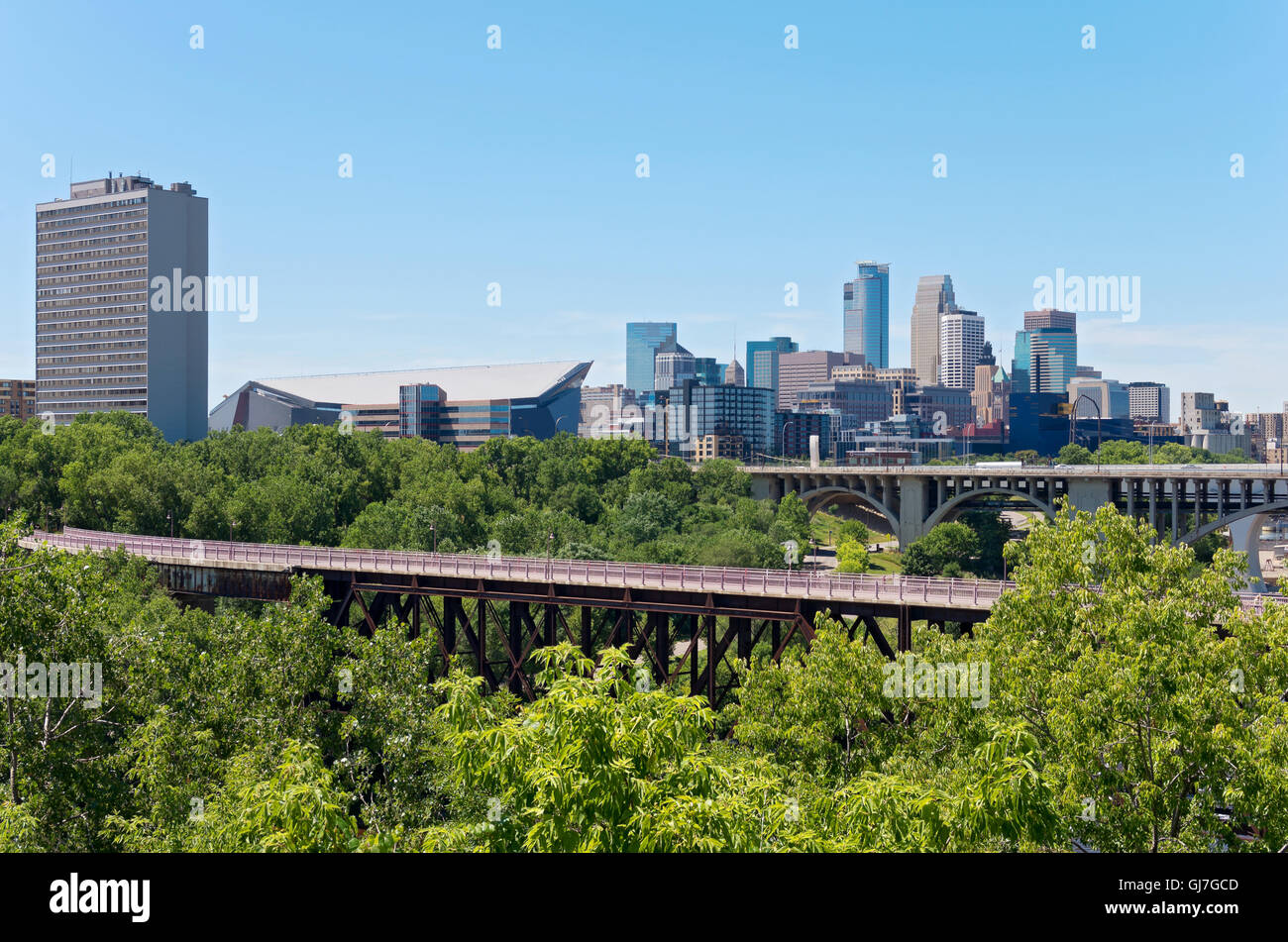 skyline of downtown minneapolis with tenth avenue and pedestrian bridge ...