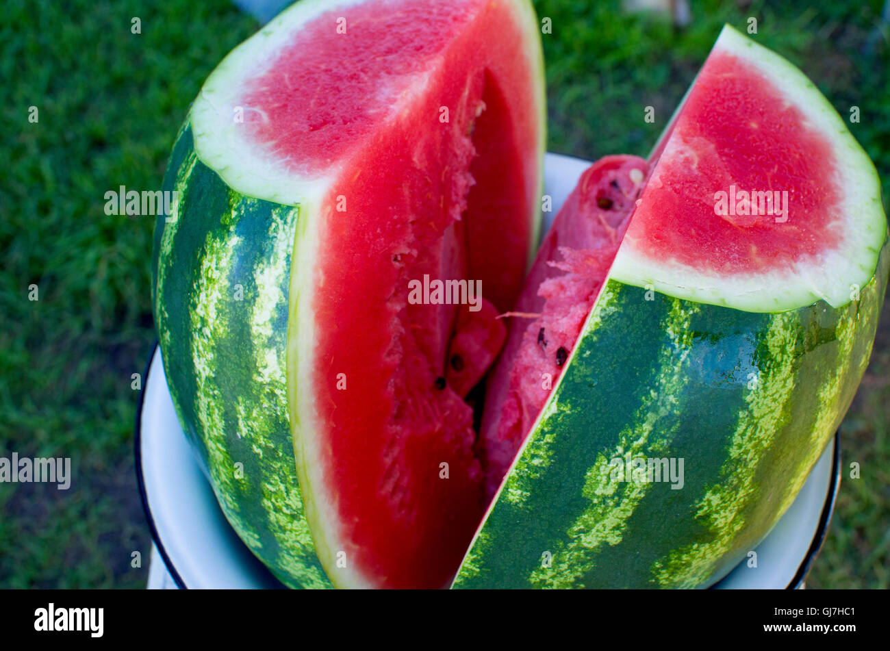 Berry a water melon ripe red with black seeds hi-res stock photography ...