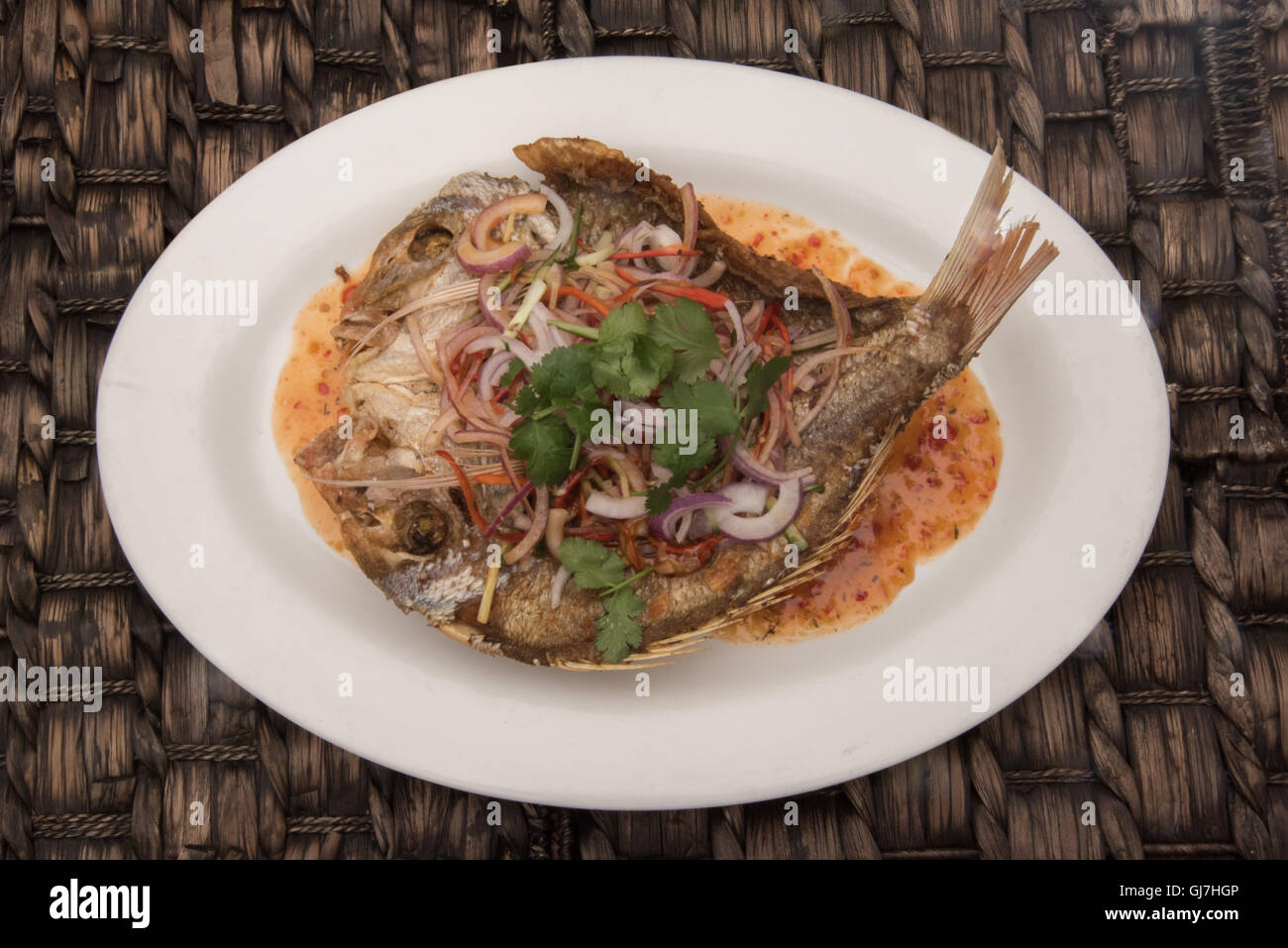 grilled fish with fresh vegetables and sweet chili sauce Stock Photo ...