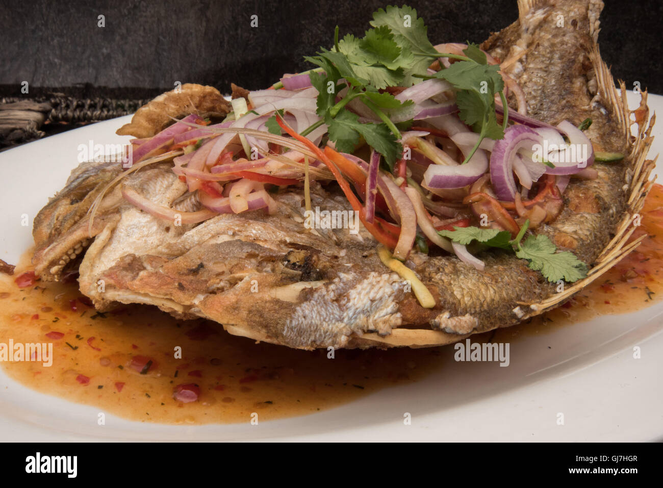 grilled fish with fresh vegetables and sweet chili sauce Stock Photo ...