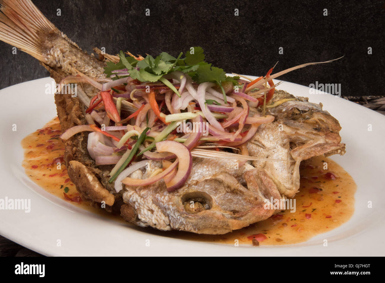 grilled fish with fresh vegetables and sweet chili sauce Stock Photo ...