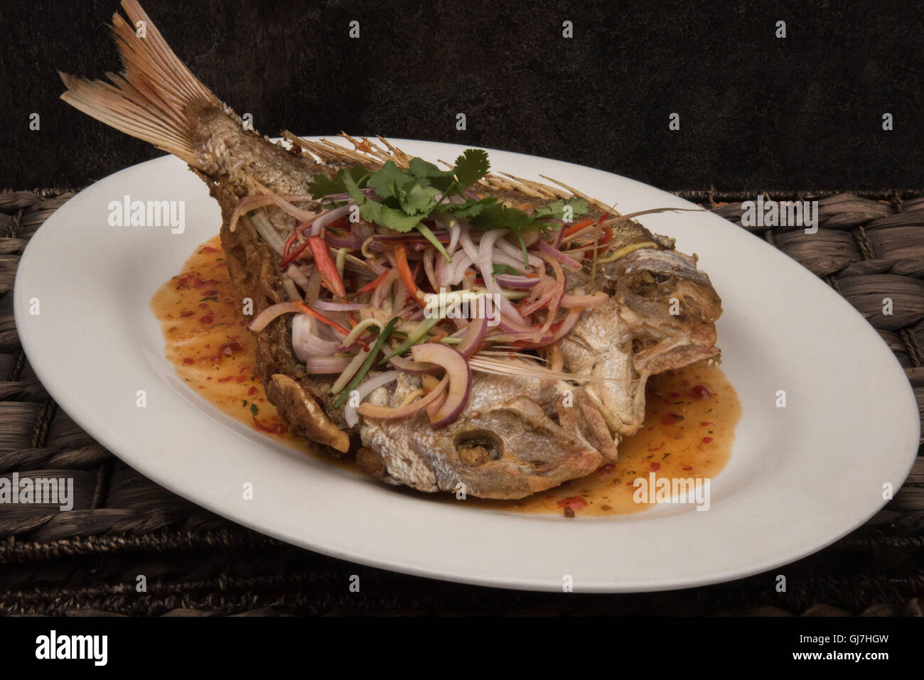grilled fish with fresh vegetables and sweet chili sauce Stock Photo ...
