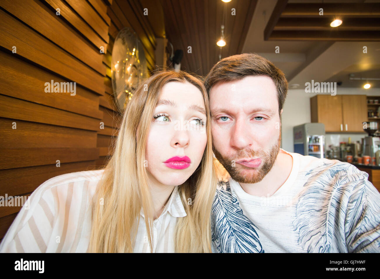 Funny playful young couple making silly face Stock Photo - Alamy