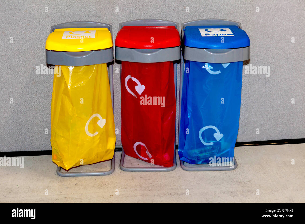 Three colourful recycling bins concept picture at a commercial premises ...