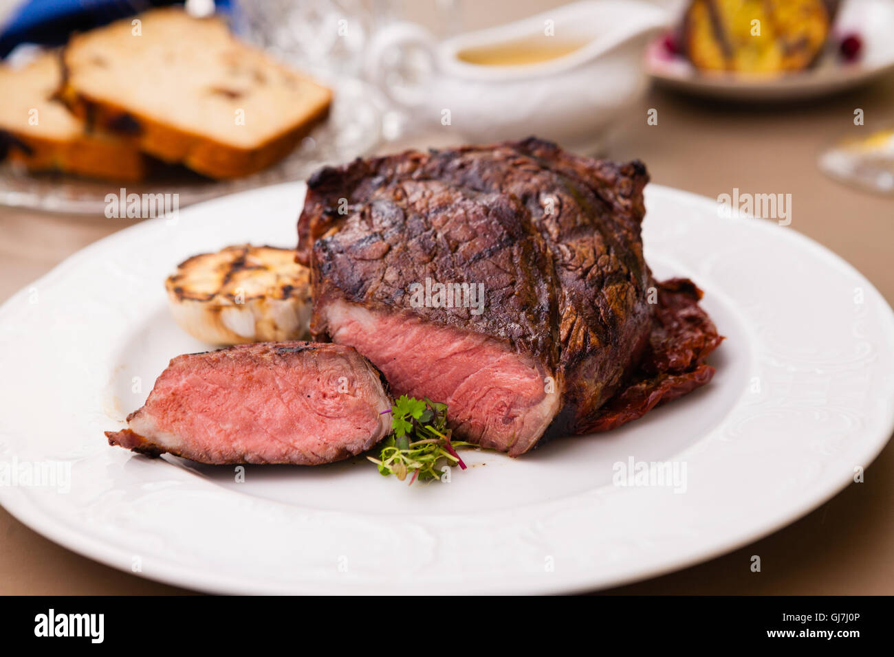 Entrecote with grilled garlic Stock Photo - Alamy