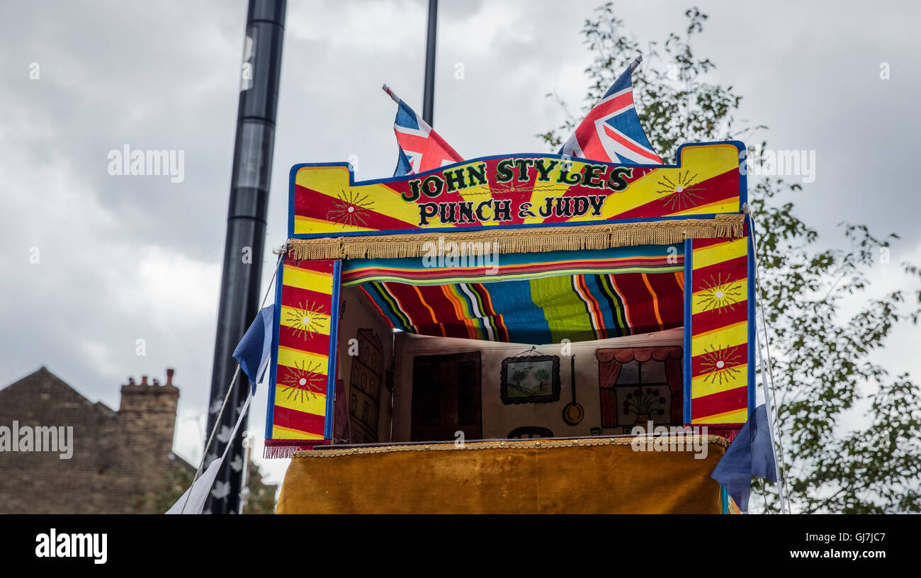 Image of an empty Punch and Judy booth set up in a street with a cloudy ...