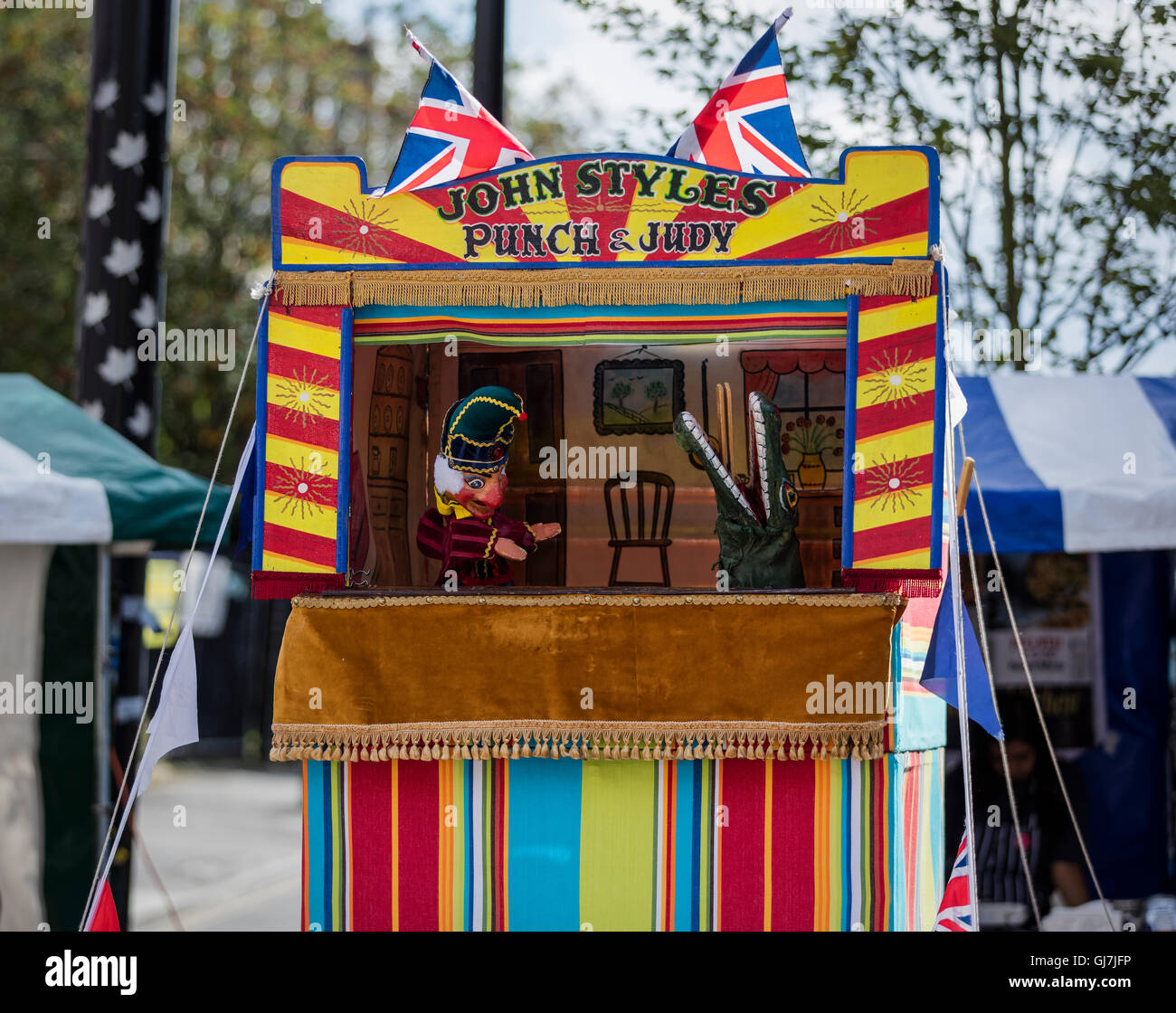 Mr Punch the puppet with a crocodile puppet with its mouth and jaws ...