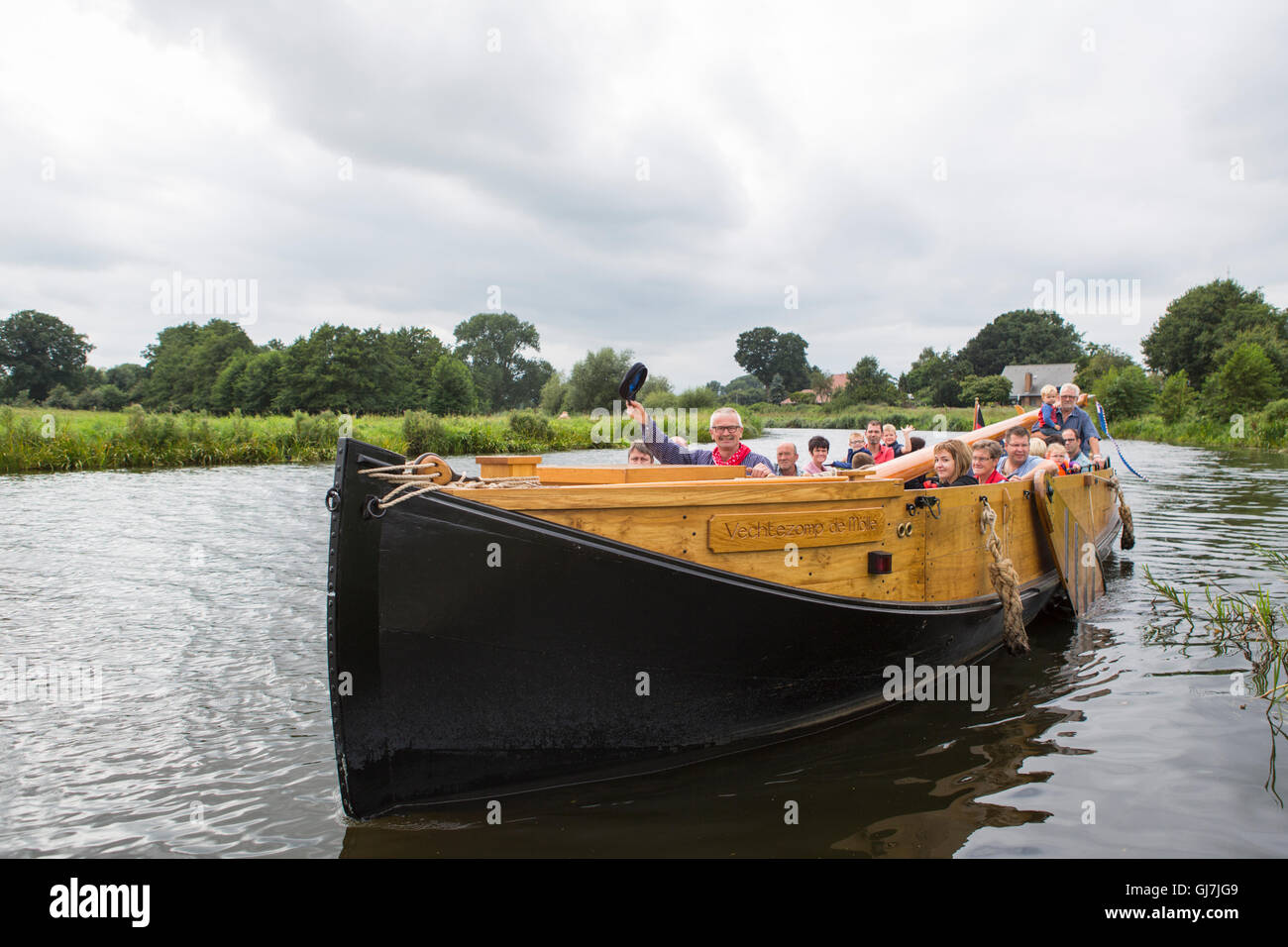 Sightseeing boat on the river Vecht arriving in Germany from a trip ...