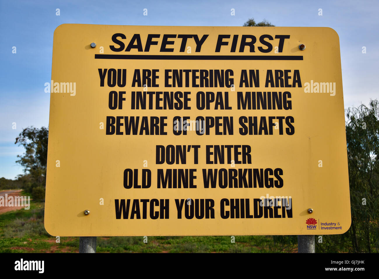 signs in lightning ridge warning of intensive mining activity including ...