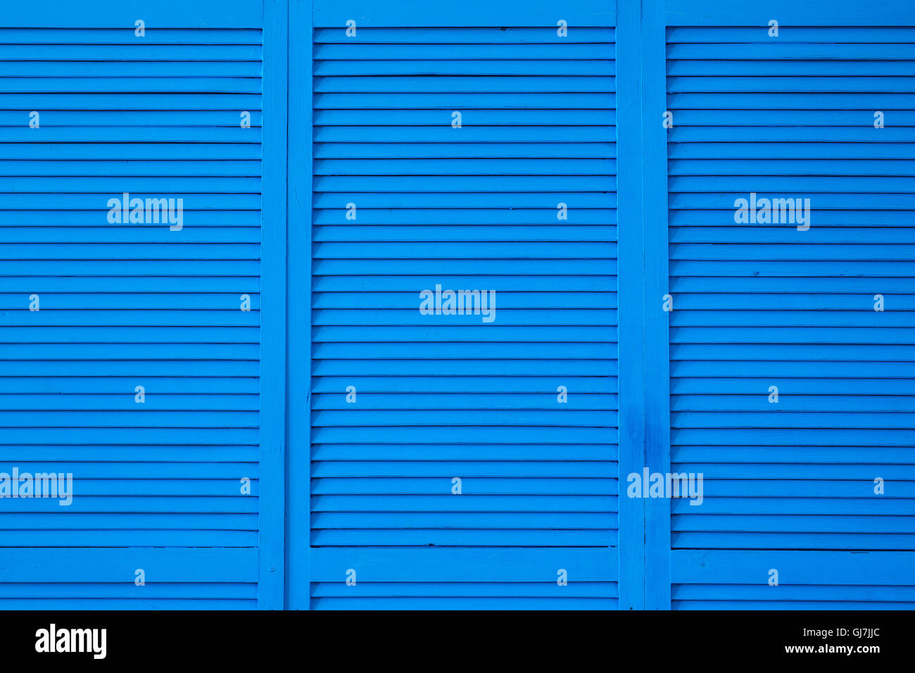 blue shuttered roll up metal door Stock Photo - Alamy