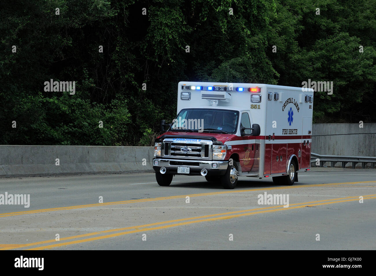 Emergency ambulance speeding towards hospital Stock Photo - Alamy