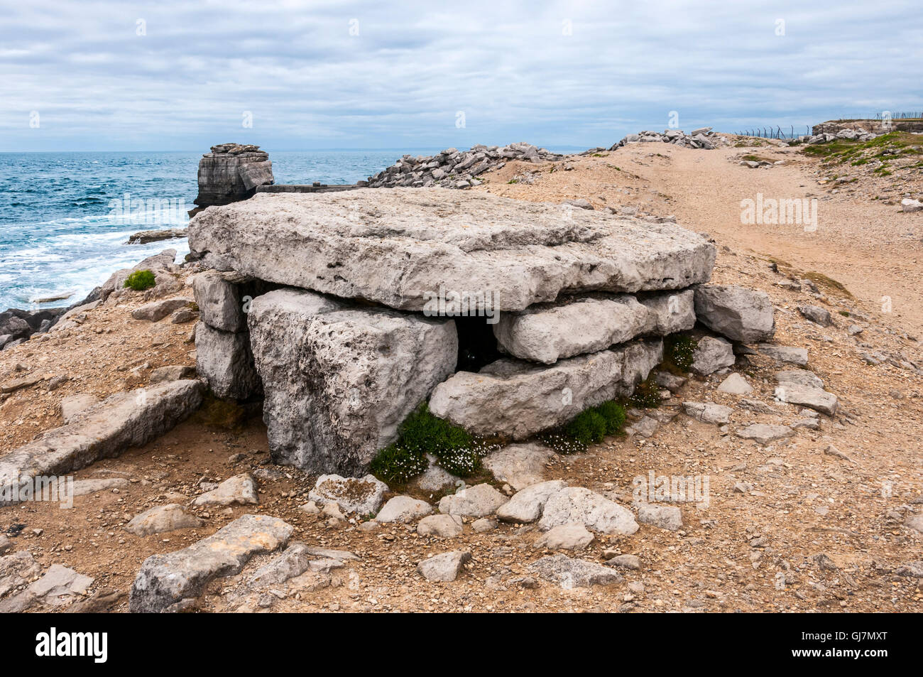 Massive slabs of grey-brown Portland Limestone form a low rectangular ...