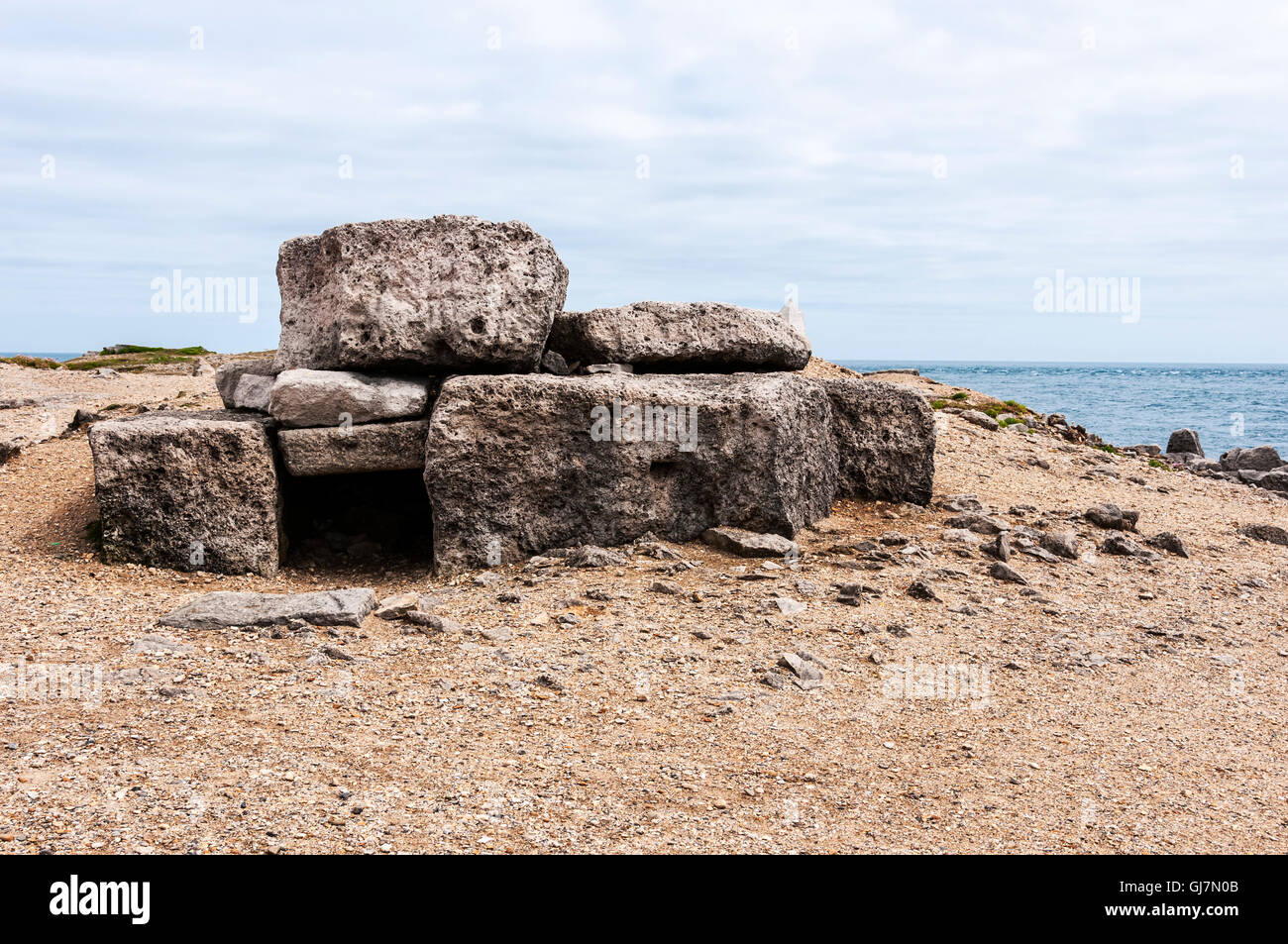 Massive slabs of grey-brown Portland Limestone form a low rectangular ...