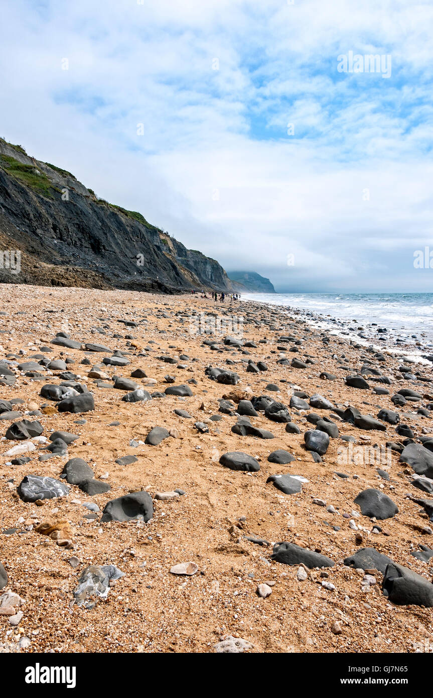 A slightly shelving beach of shingle, stones and sand between high ...