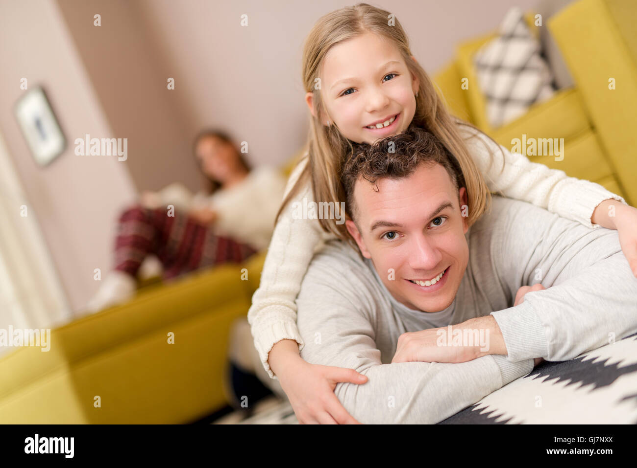 Family Relaxing At Home Stock Photo - Alamy