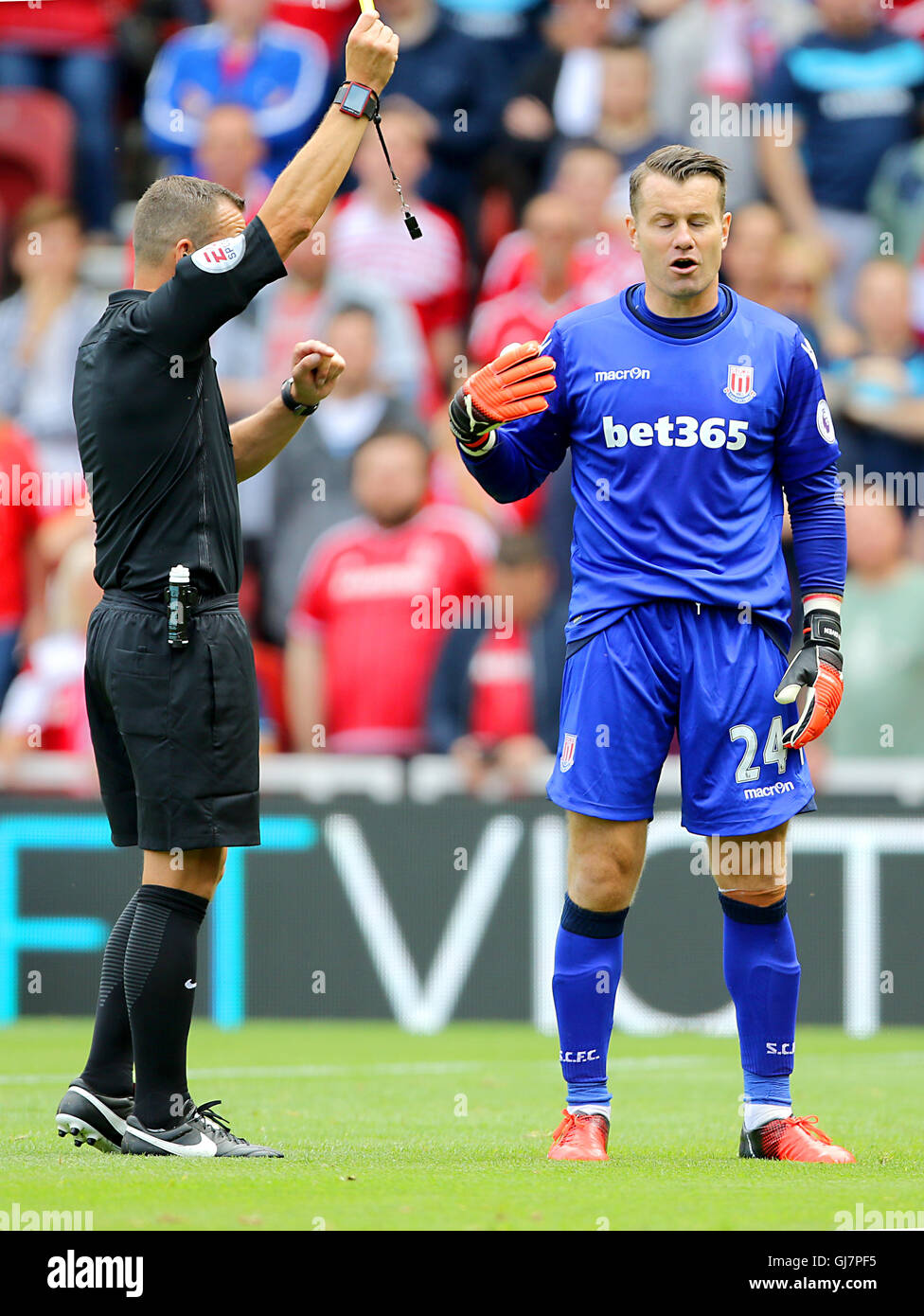 Stoke City's Shay Given is shown the yellow card by referee Kevin ...