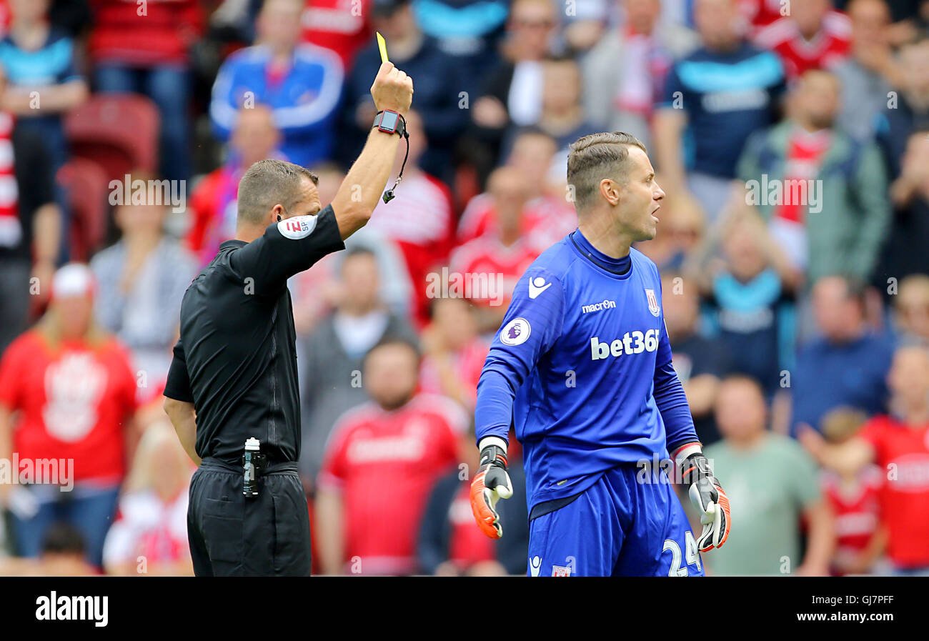 Stoke City's Shay Given is shown the yellow card by referee Kevin ...