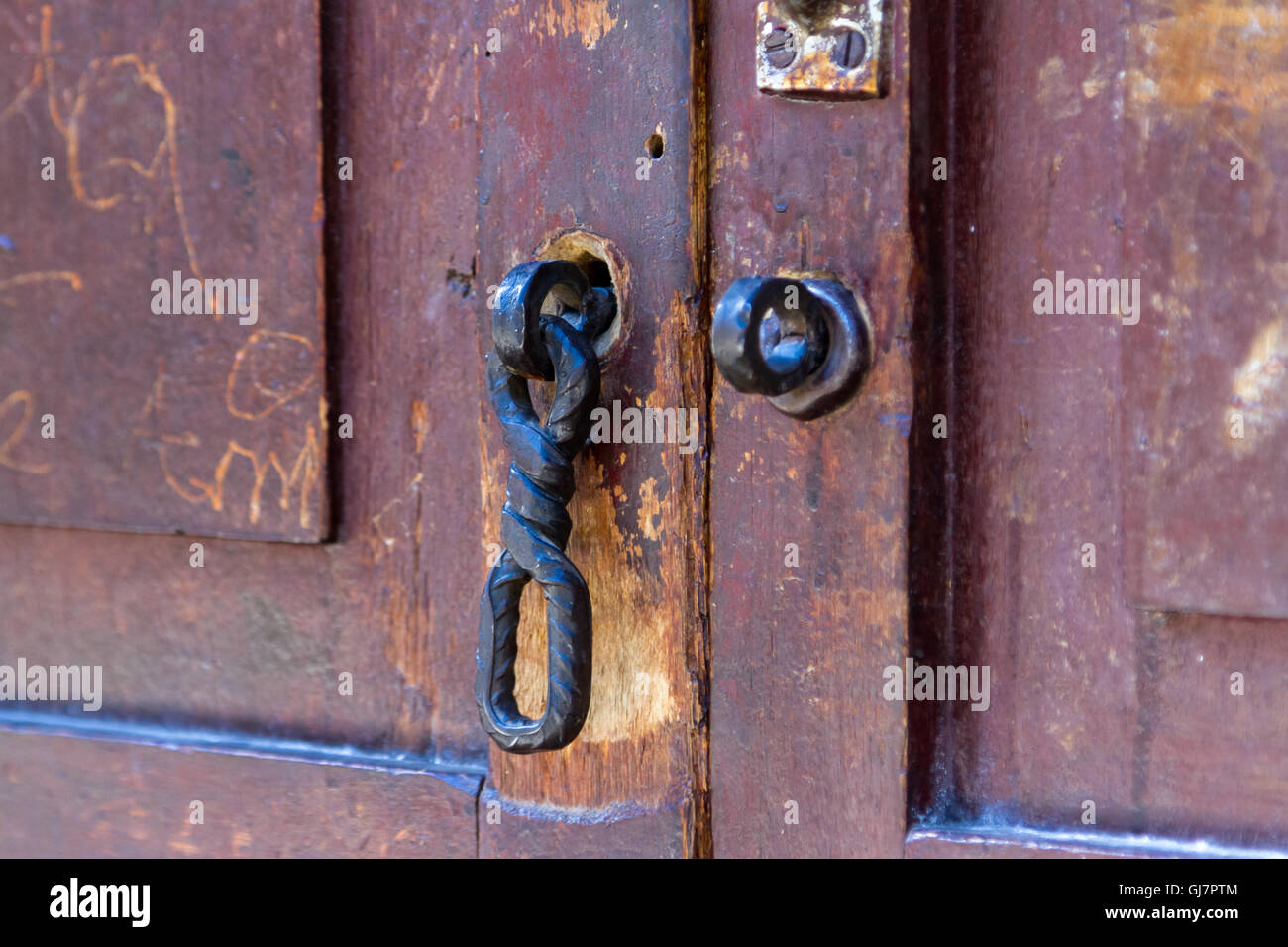 close up of an old lock on a solid wooden door with lots of wear Stock ...