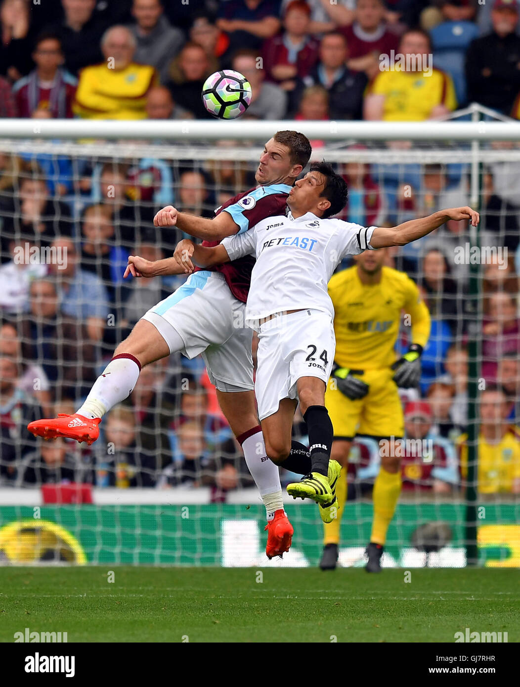 Swansea City's Jack Cork (right) and Burnley's Dean Marney battle for ...