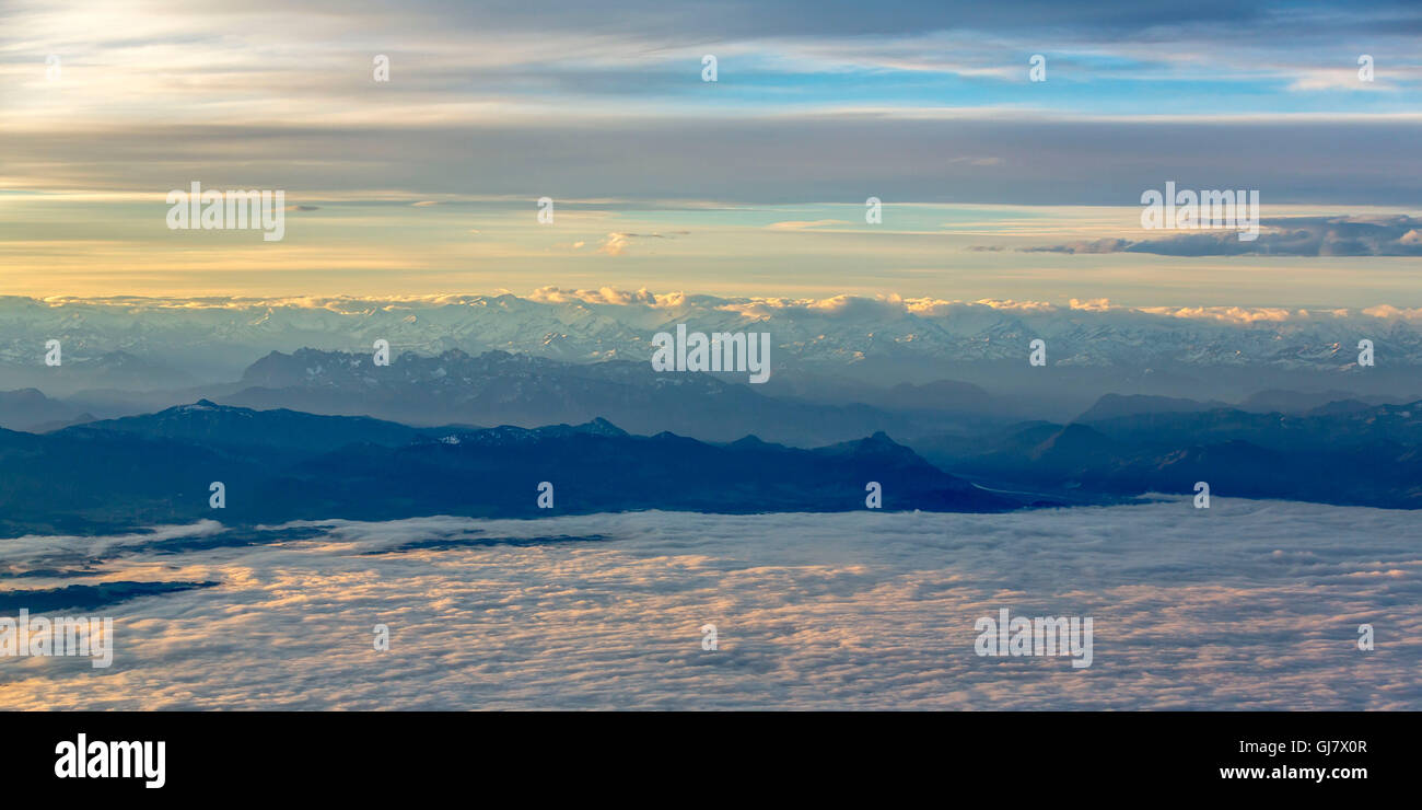 Over the clouds, alps, panorama, sunrise, flight, are flying Stock ...