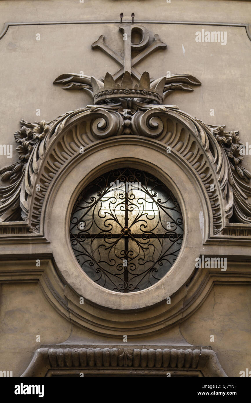 Round window on a church in Rome, Italy Stock Photo - Alamy