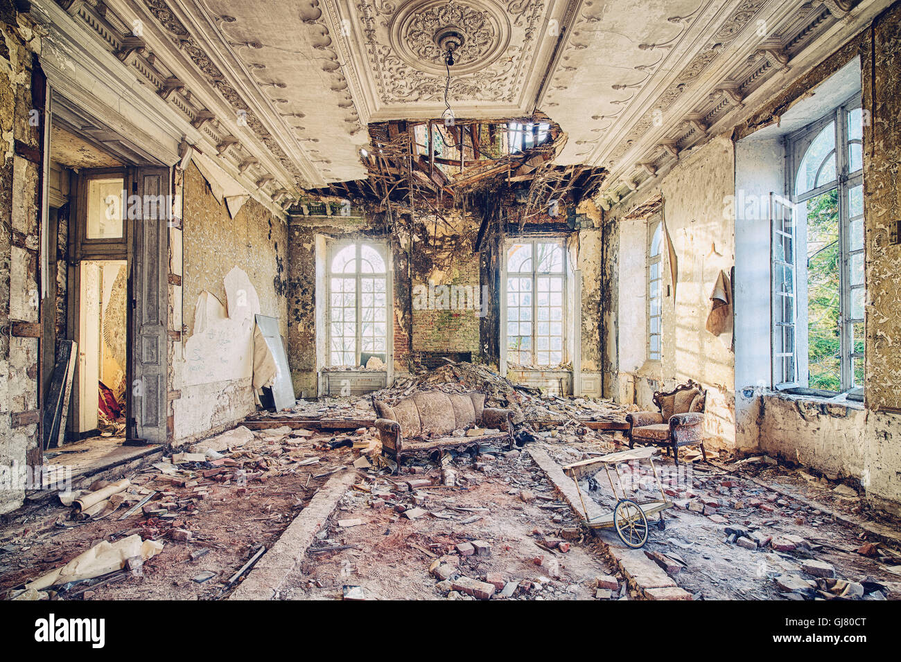 living area of a derelict castle with sofa Stock Photo - Alamy