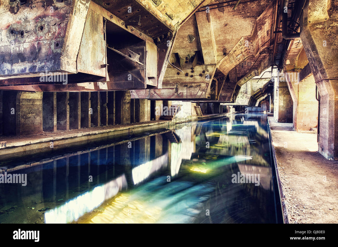 former silo for ore with water Stock Photo - Alamy