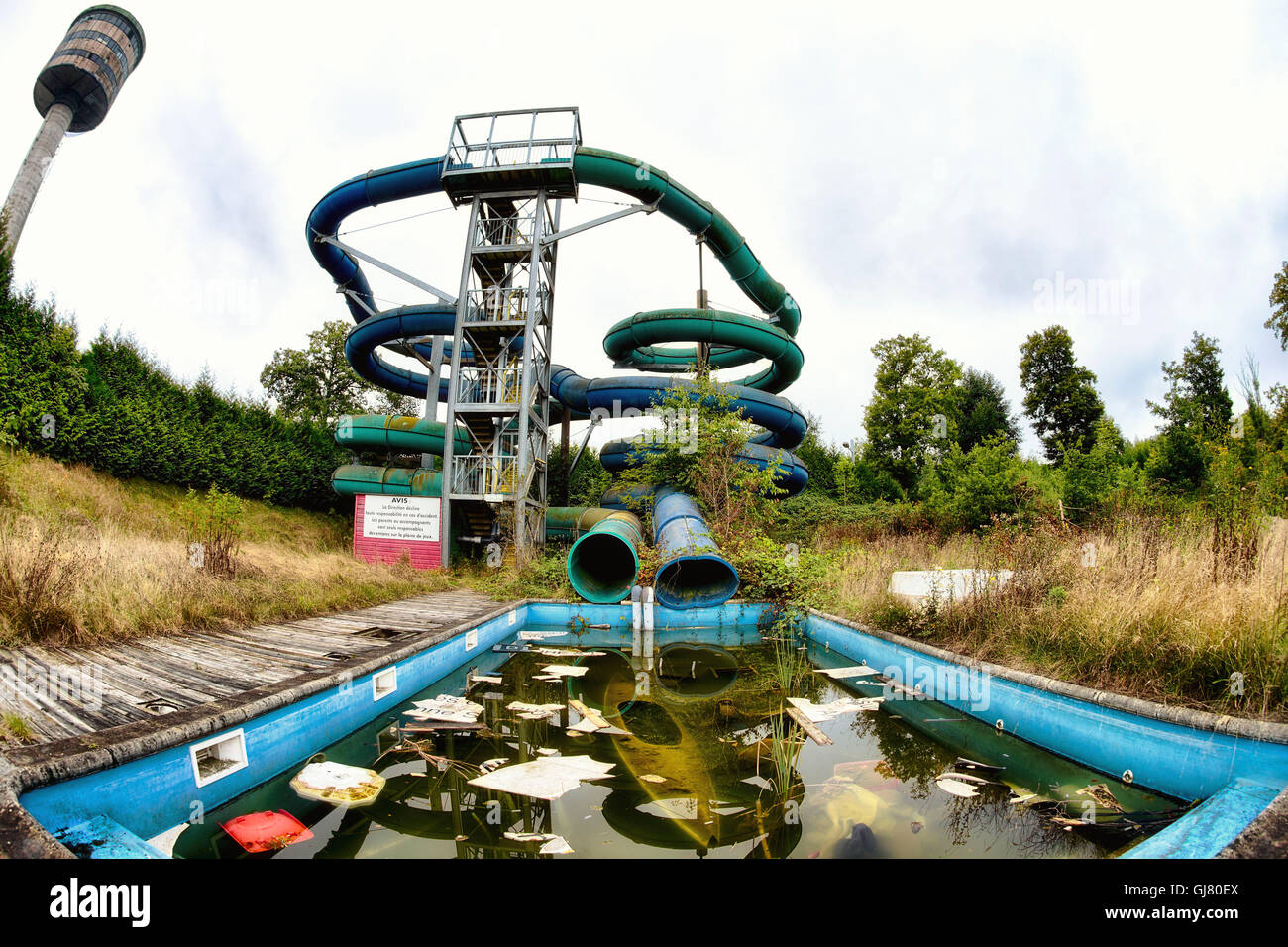abandoned outdoor swimming pool with slides Stock Photo - Alamy