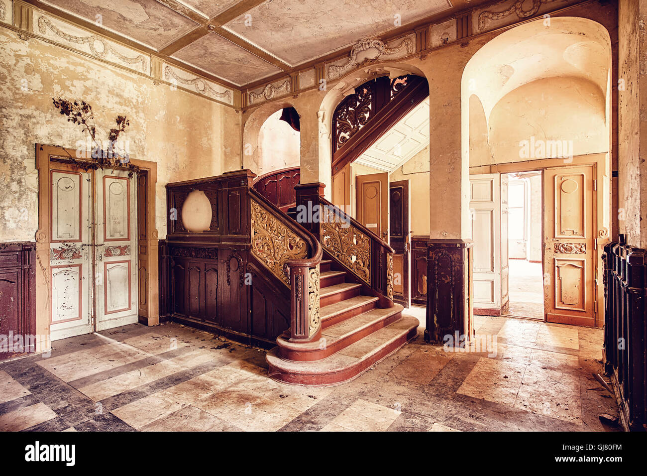 entrance hall with stairway in an abandoned castle Stock Photo - Alamy
