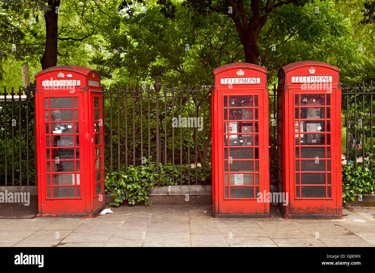 Park, fence, telephone box, communication Stock Photo - Alamy