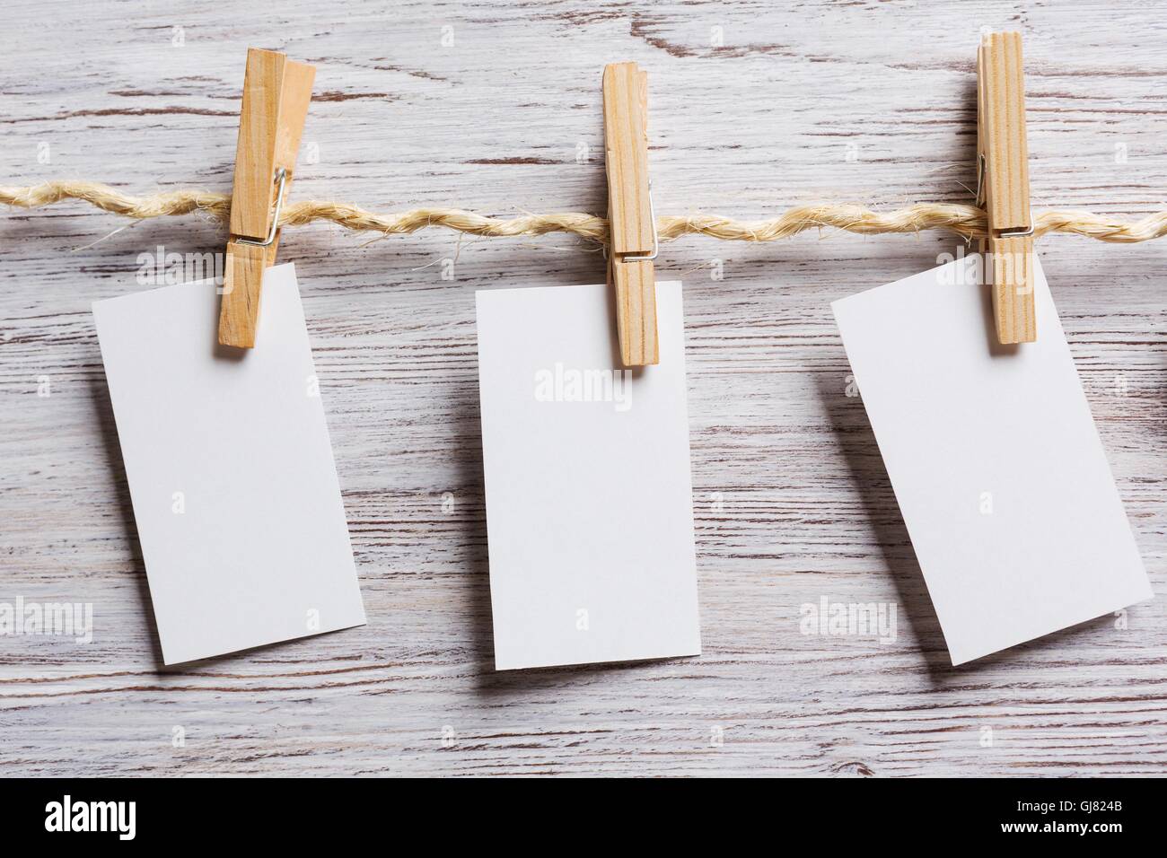 Paper hang on clothesline Stock Photo - Alamy
