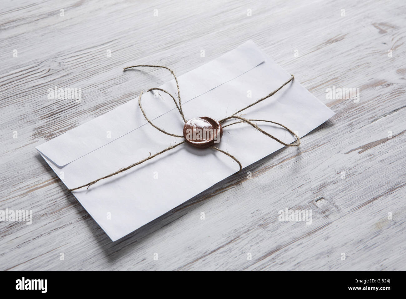 Letter with seal on table Stock Photo - Alamy