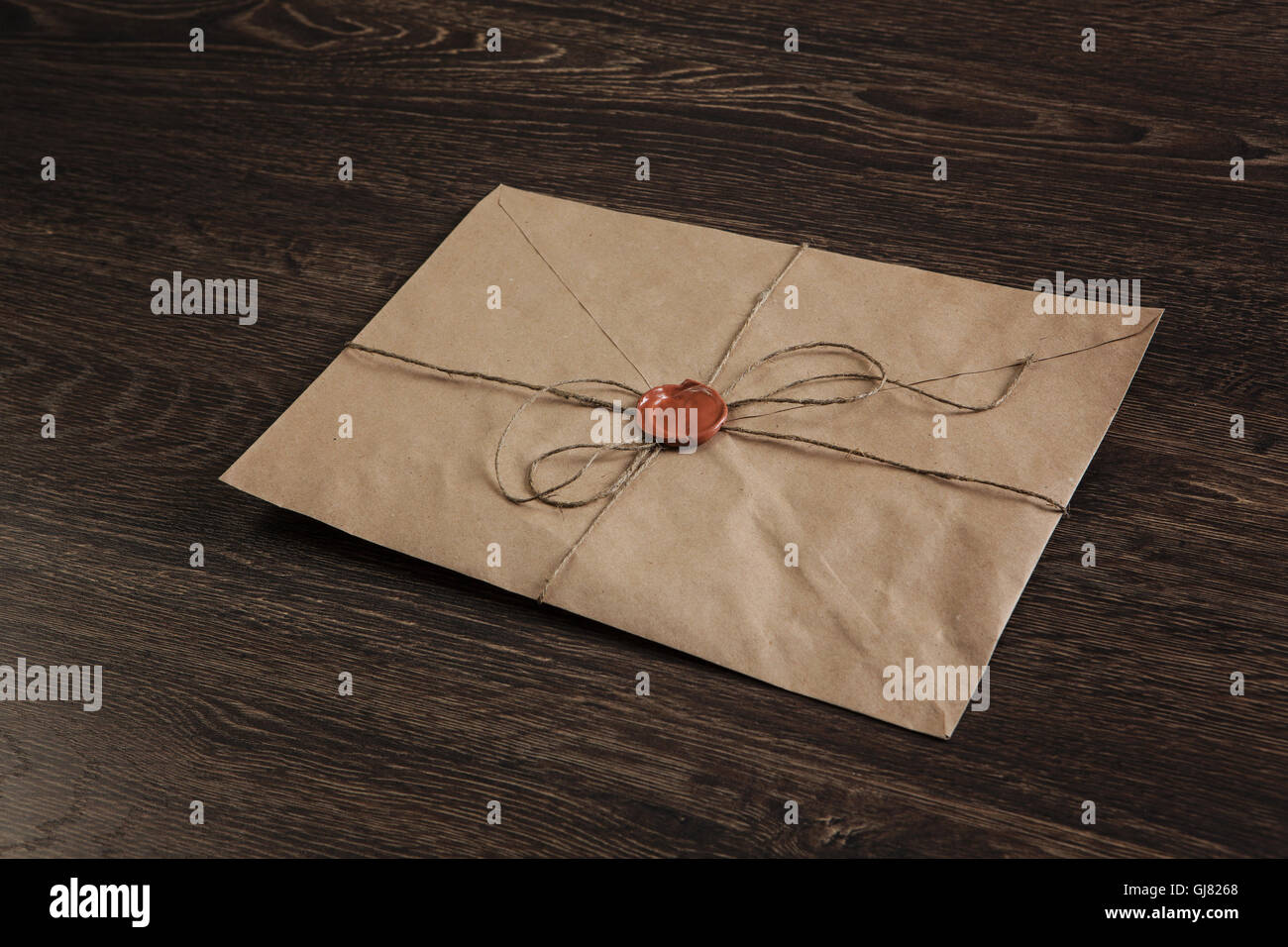 Letter with seal on table Stock Photo - Alamy