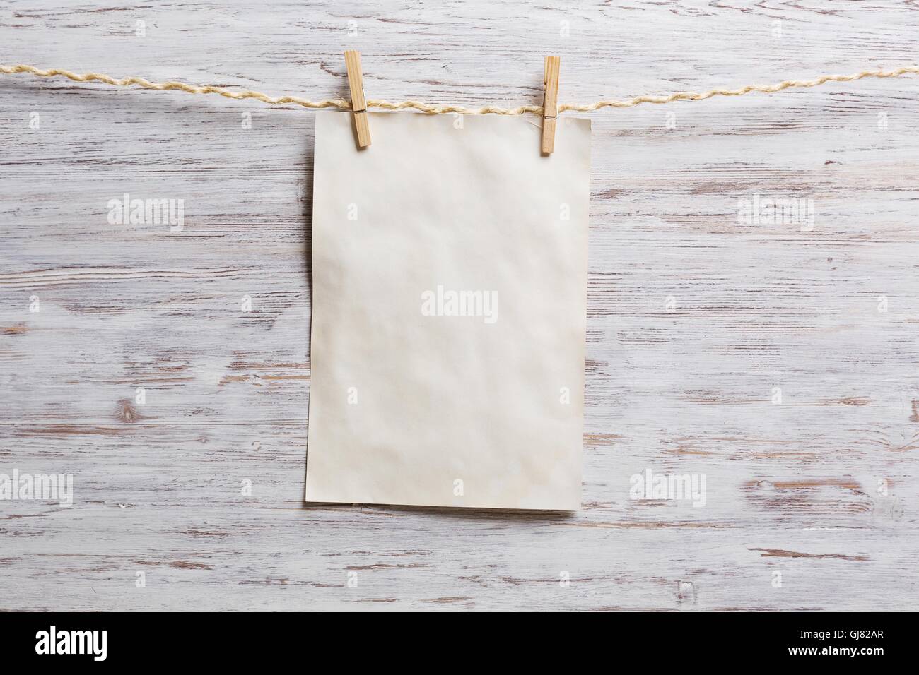 Paper hang on clothesline Stock Photo - Alamy