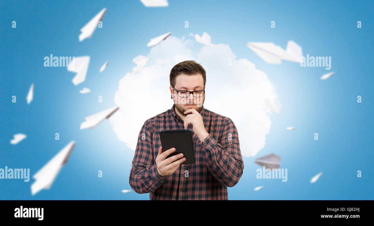 Hipster guy with tablet device . Mixed media Stock Photo - Alamy