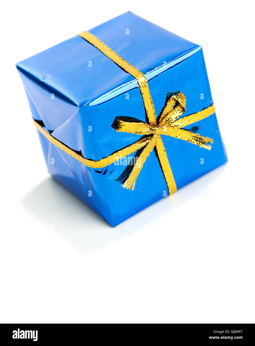 Series of miniature, colorful gift boxes, some on colored backgrounds ...