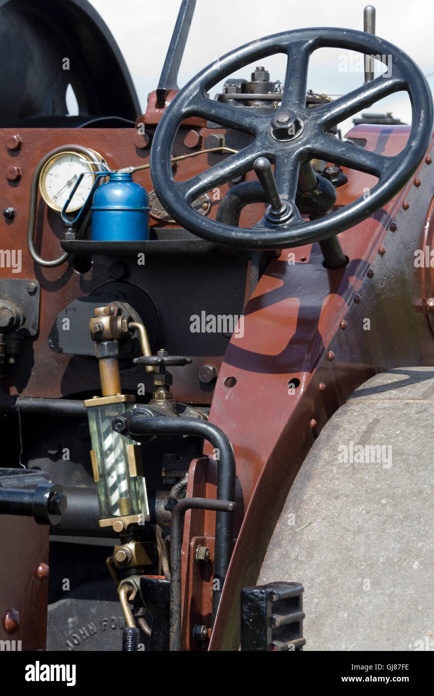 Steering wheel and Engine room of a Traction Steam Engine Stock Photo ...