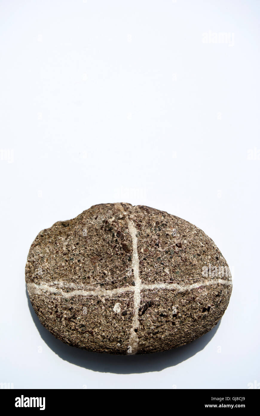 The stone with the sign plus isolated on white Stock Photo - Alamy