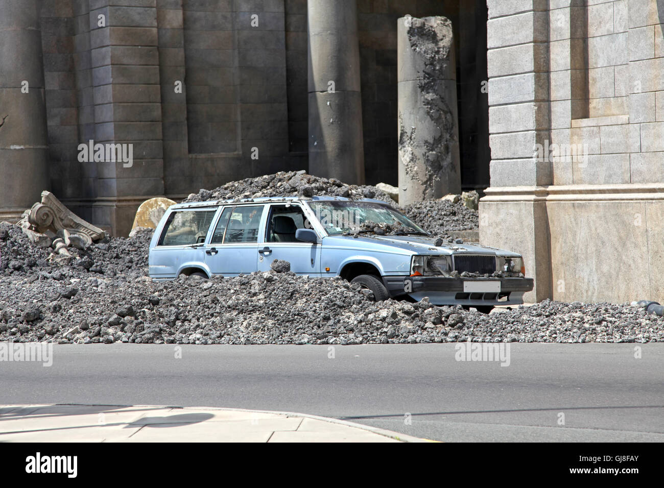 A car crashed in amongst concrete rubble Stock Photo - Alamy