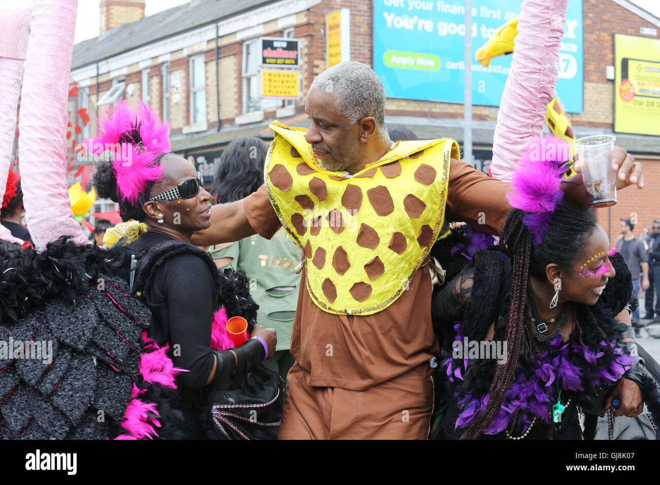 Manchester, UK. 13th Aug, 2016. Caribbean carnival goers dancing on the ...