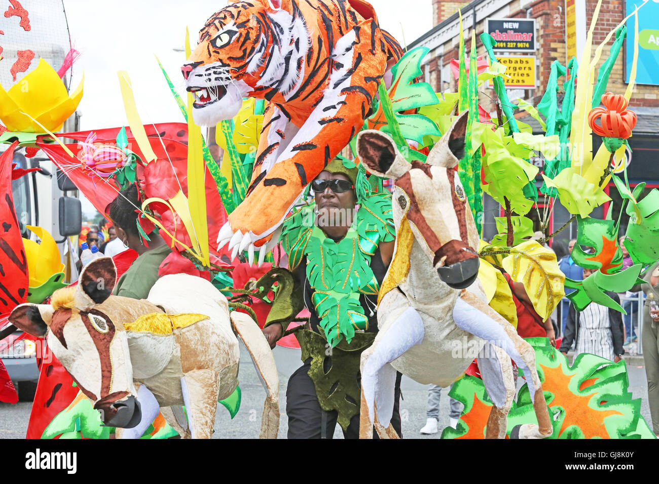 Manchester, UK. 13th Aug, 2016. A man carrying a life size model of ...