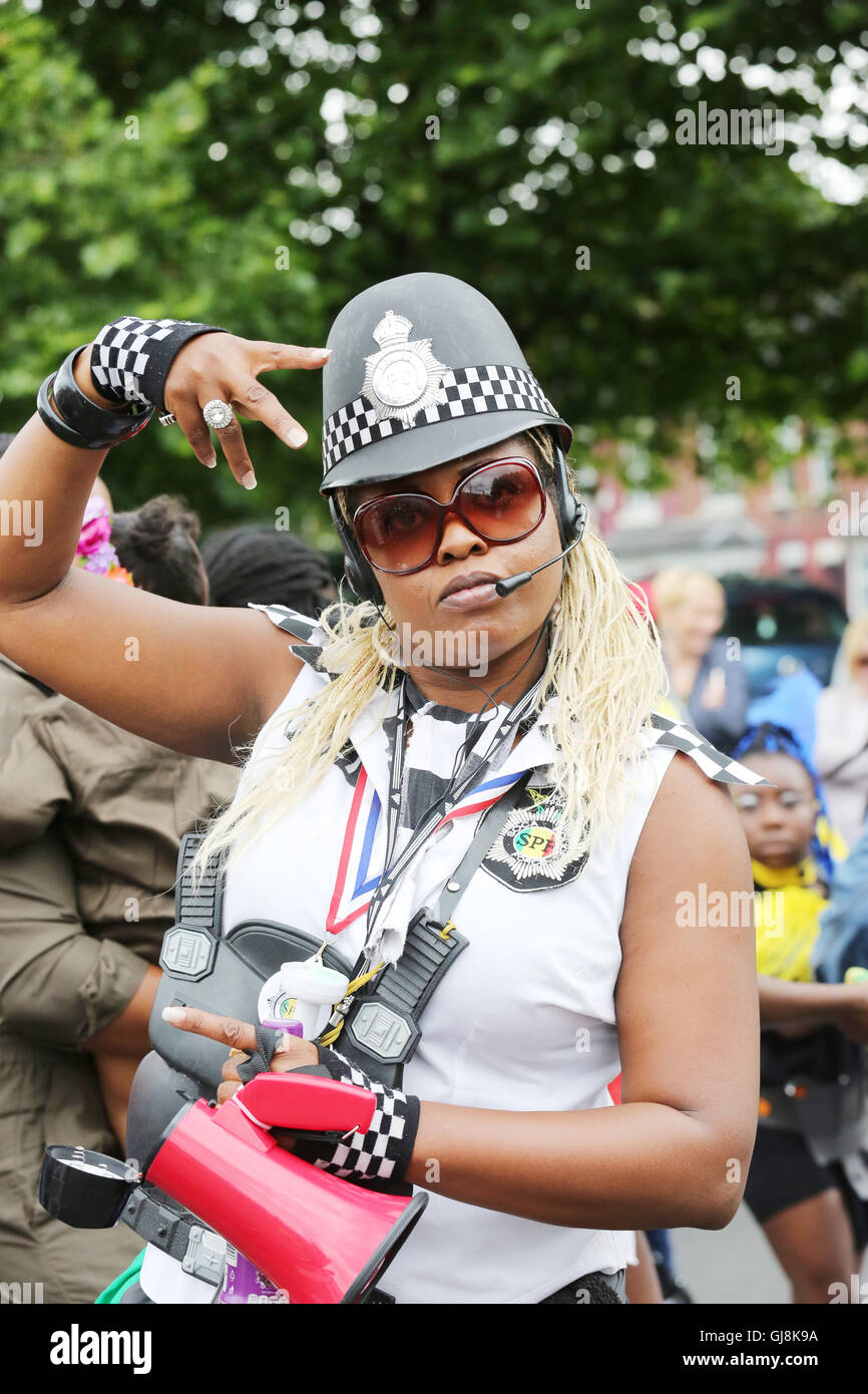 Manchester, UK. 13th Aug, 2016. A women dressed like a police officer ...