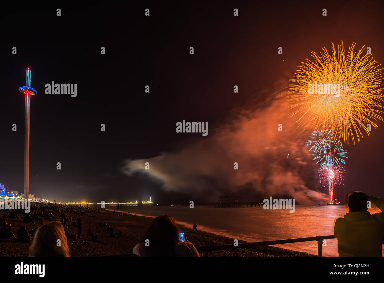 Brighton, UK. 13th Aug, 2016. Sightseers throng the beach for light ...