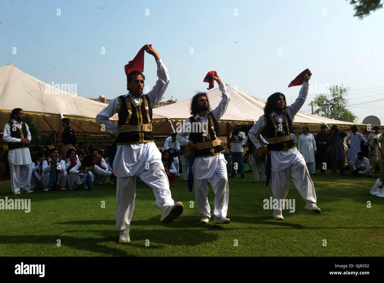 Pakistani men perform traditional dance hi-res stock photography and ...