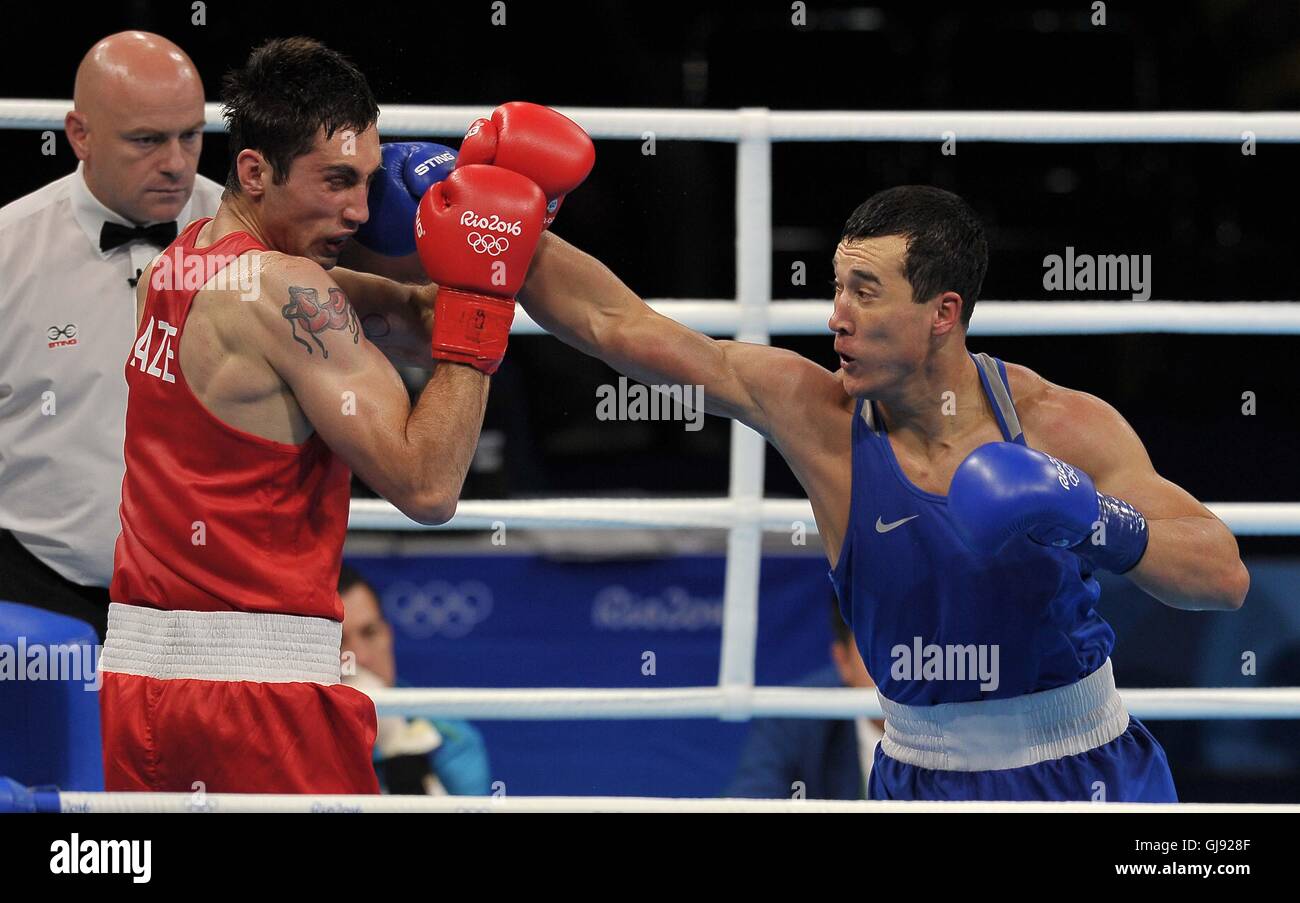 Teymur Mammadov (AZE, red) and Adilbek Niyazymbetov (KAZ). Boxing. Riocentro 6. Olympic park ...