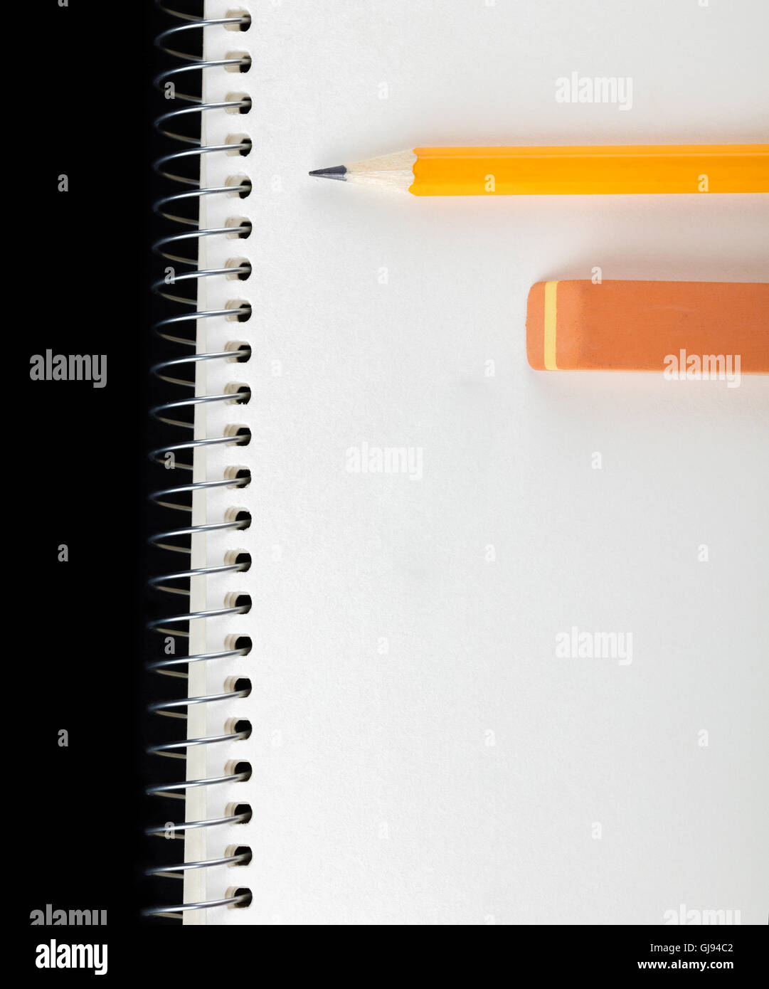sharpened pencil and eraser laying on notebook Stock Photo - Alamy