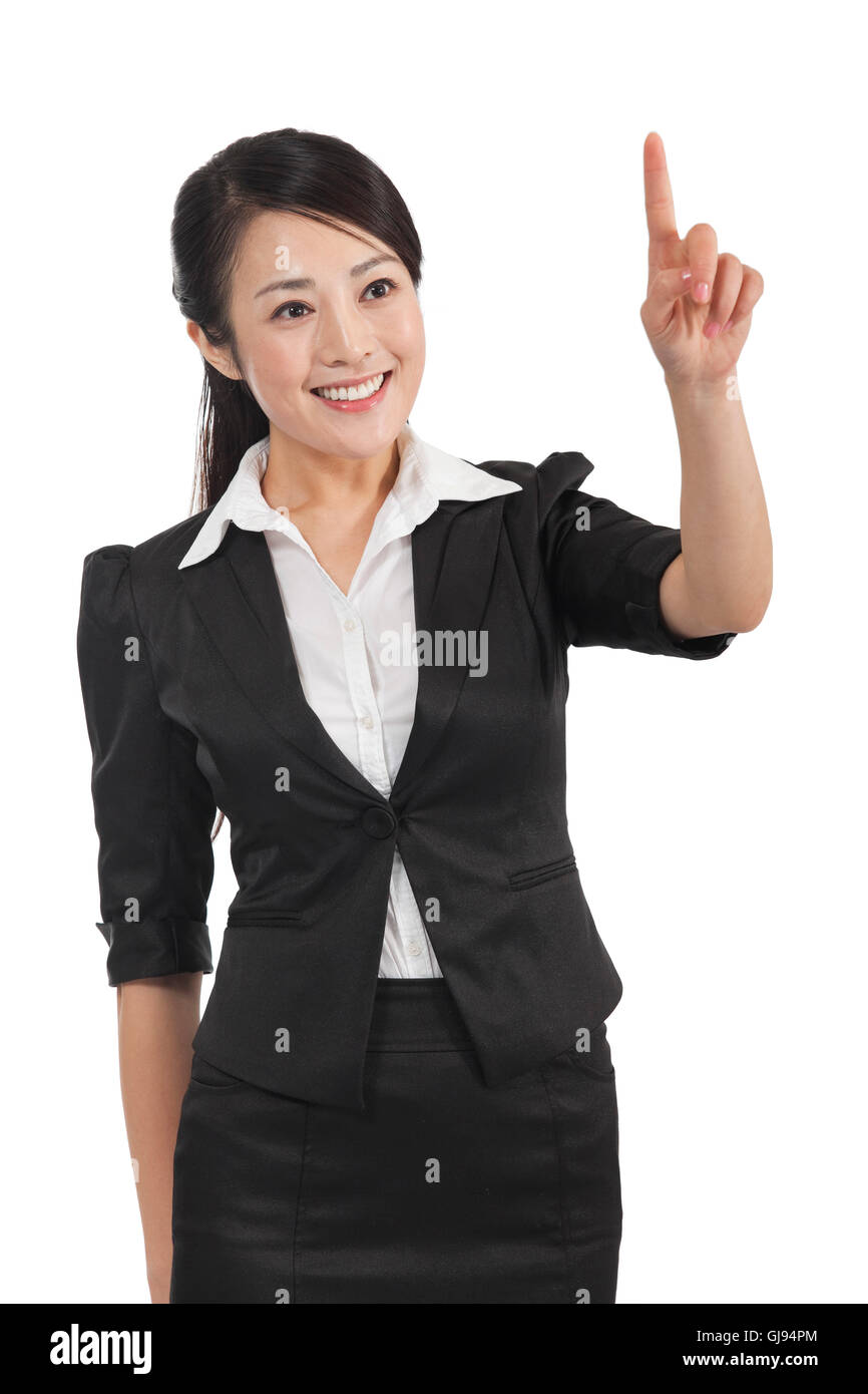 Business lady pointing studio shot Stock Photo - Alamy